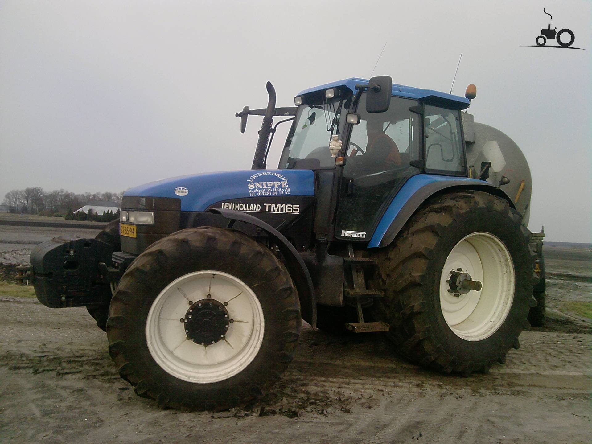 Foto New Holland TM 165 #599559